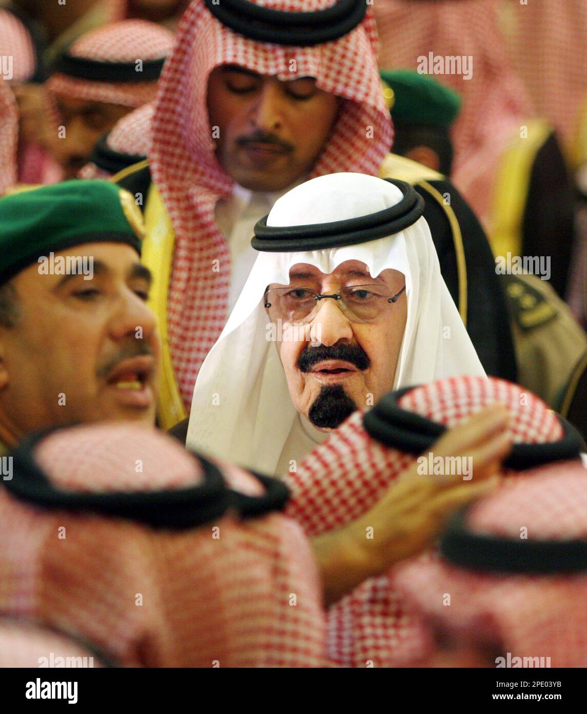 A police officer gestures as Saudi new King Abdullah center, receives ...