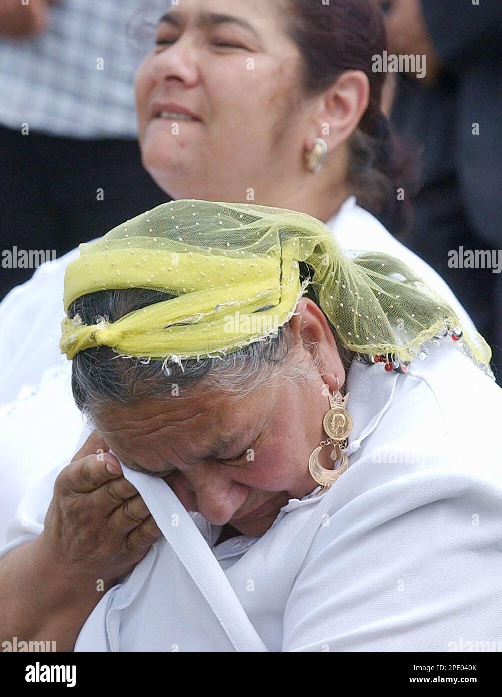 A gypsy wipes her eyes during the official ceremony, Tuesday, Aug. 2 ...