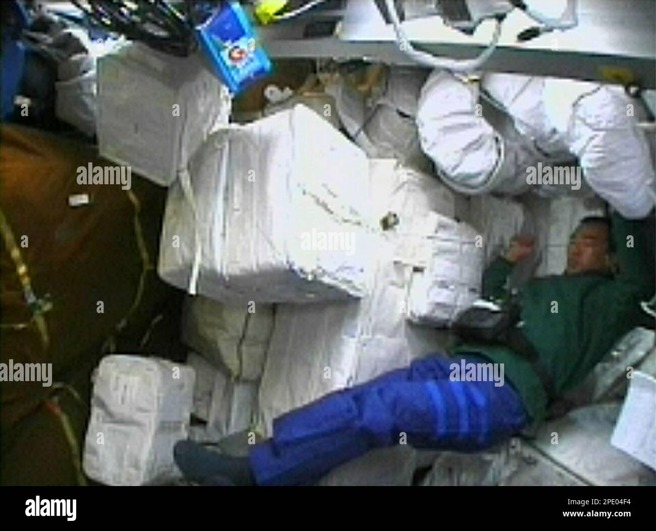 Japanese astronaut Soichi Noguchi floats surrounded by stowage bags in ...