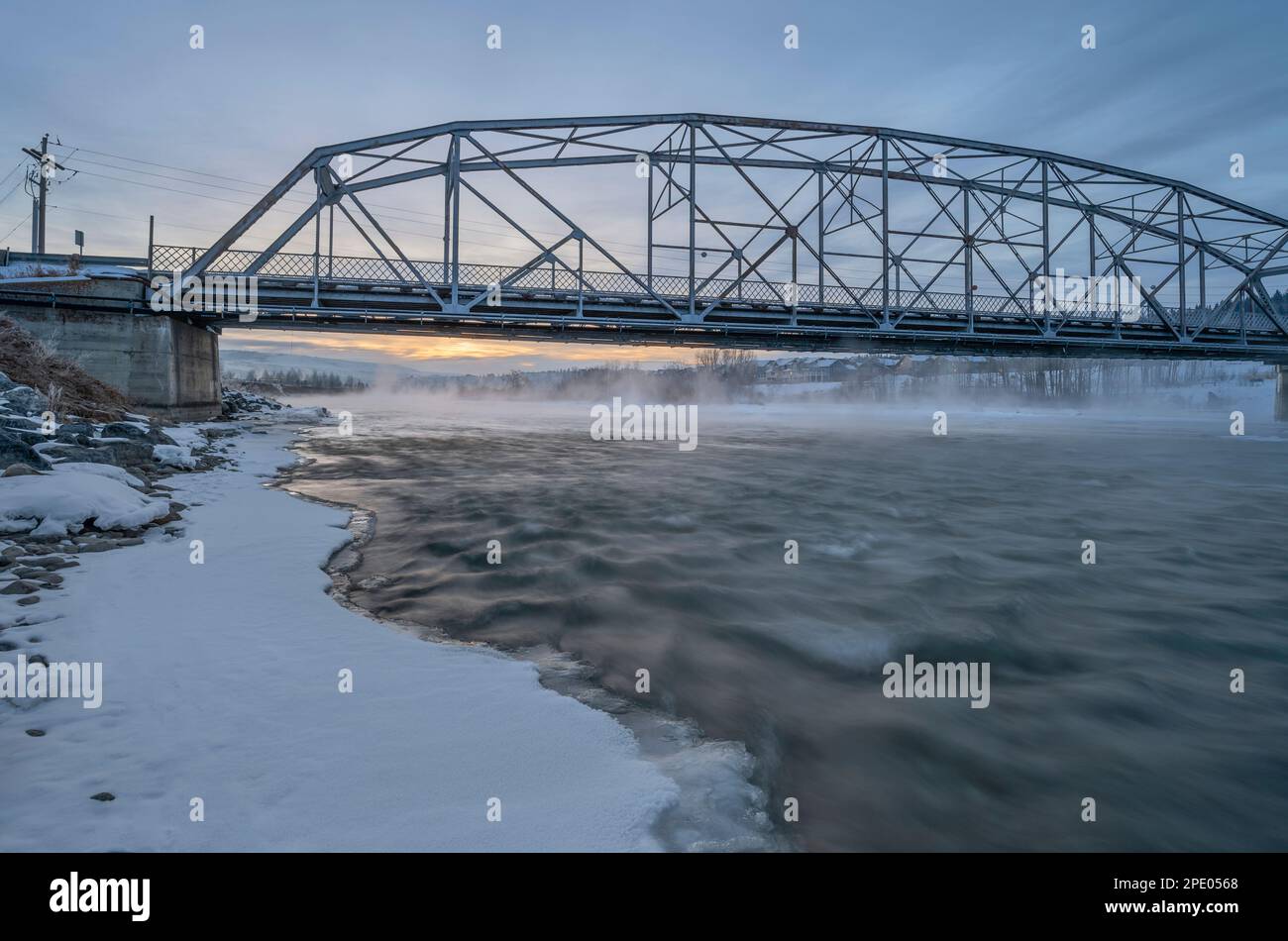 Winter sunrise on the Bow River and a bridge in Cochrane, Alberta ...