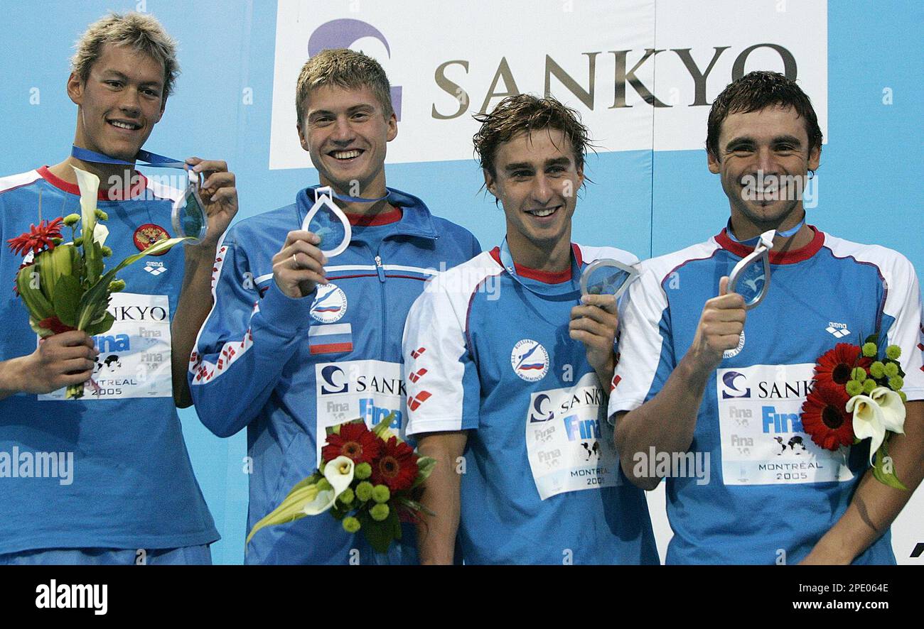 Members of team Russia show off their silver medals for the men's ...