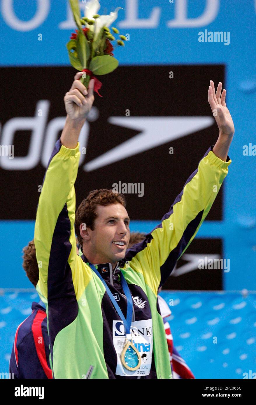 Men's 1500m freestyle gold medallist Grant Hackett raises his hands as ...
