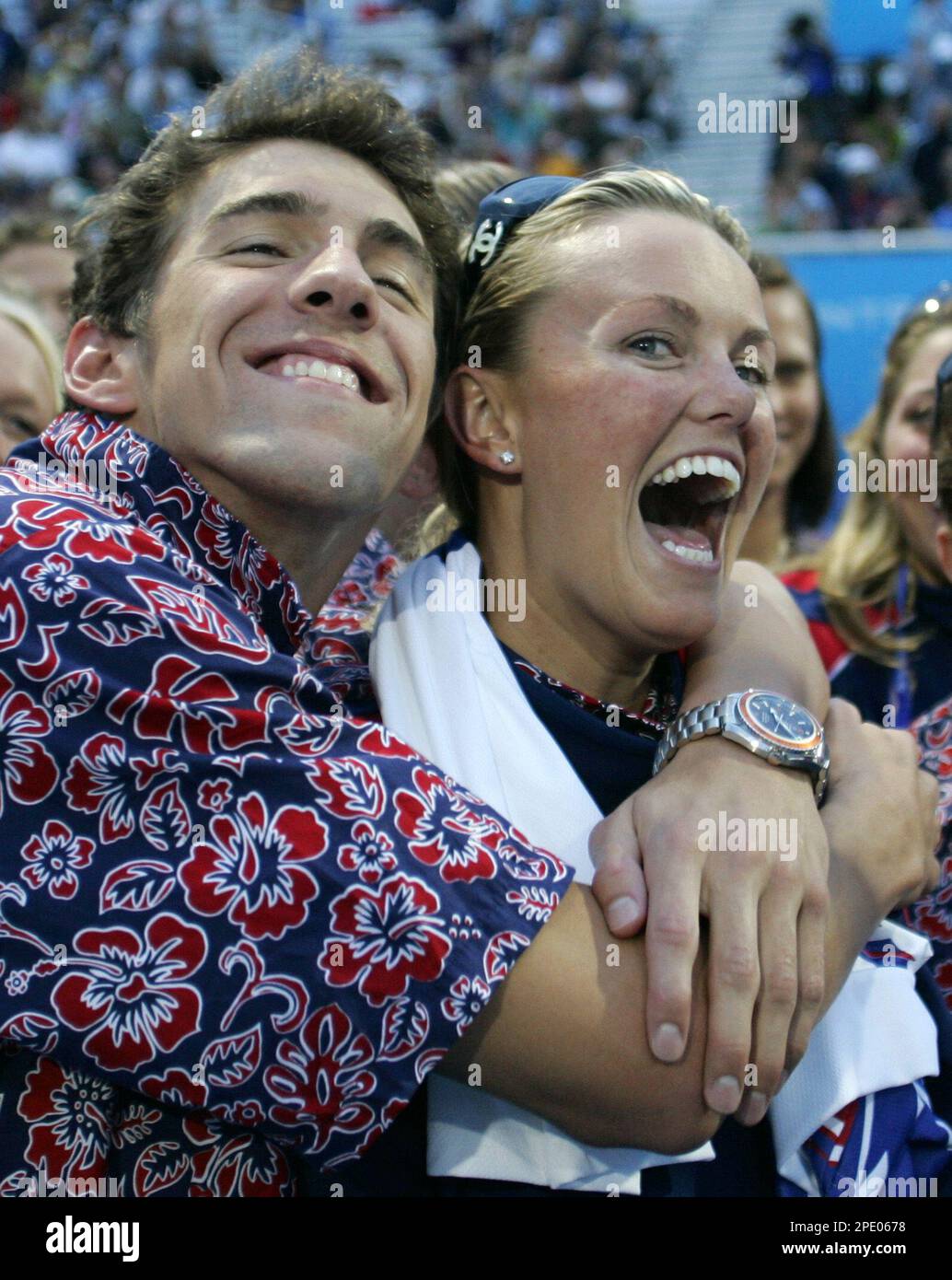 USA's Michael Phelps, left, laughs with his teammate Jeri Moss at the ...