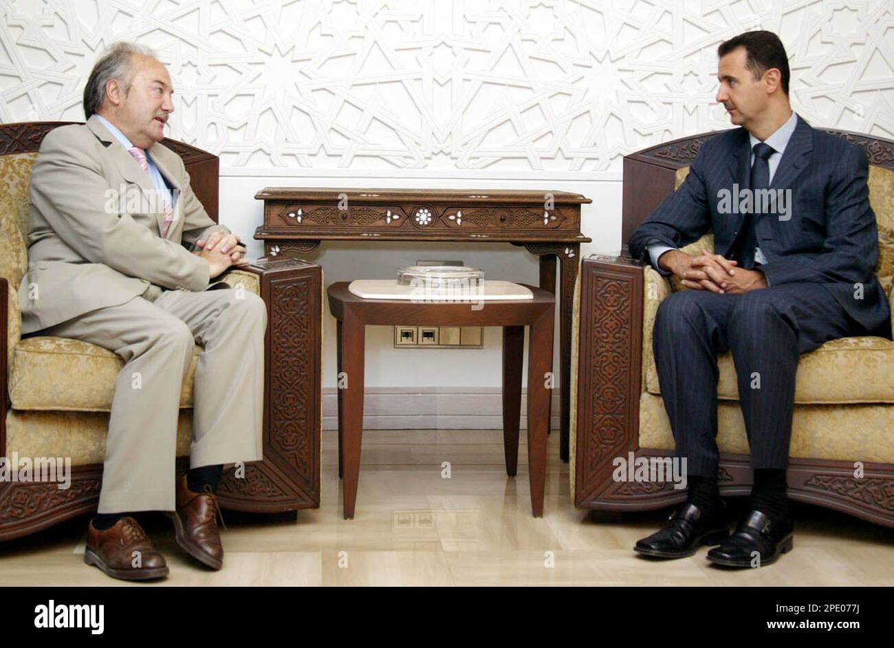 Syria President Bashar Assad, right, meets George Galloway, member of ...