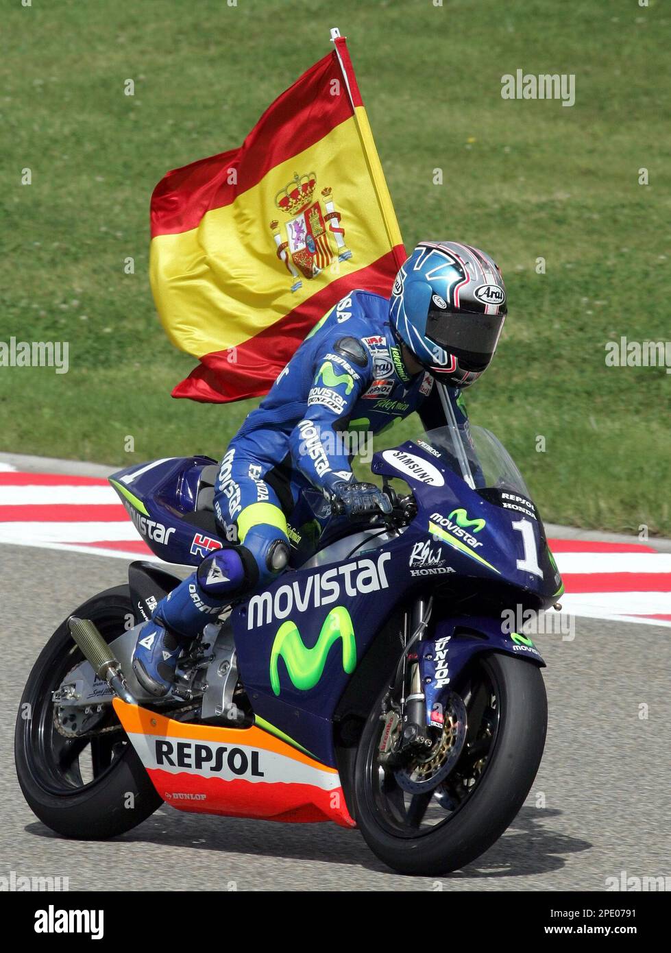 Spain's Daniel Pedrosa celebrates on his Honda after winning the 250cc ...