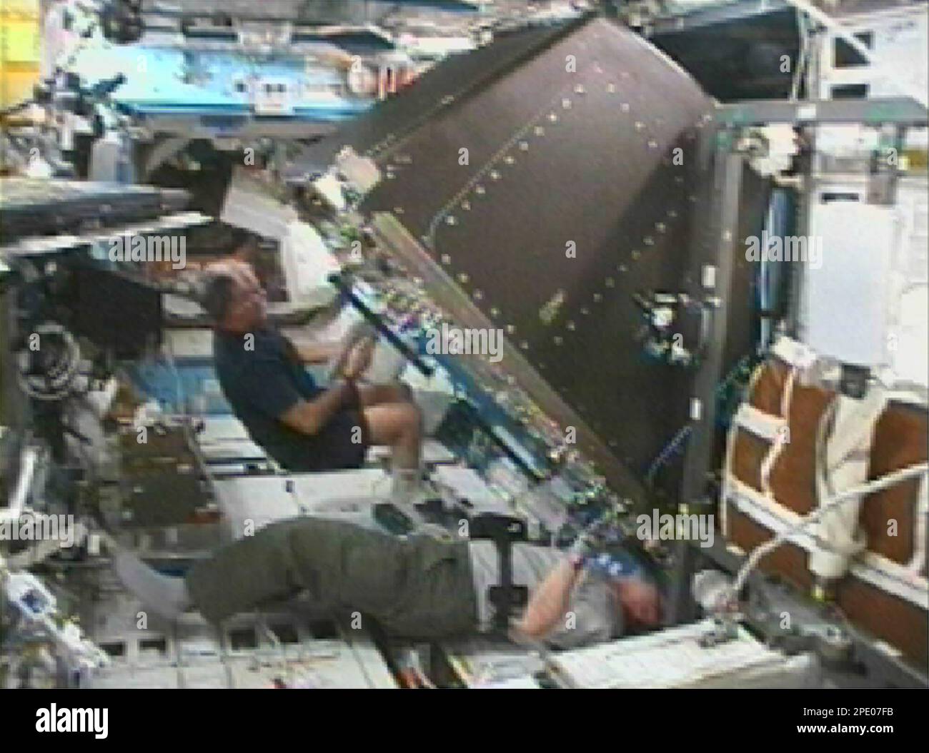 Astronaut John Phillips, top, and pilot James Kelly move the Human ...