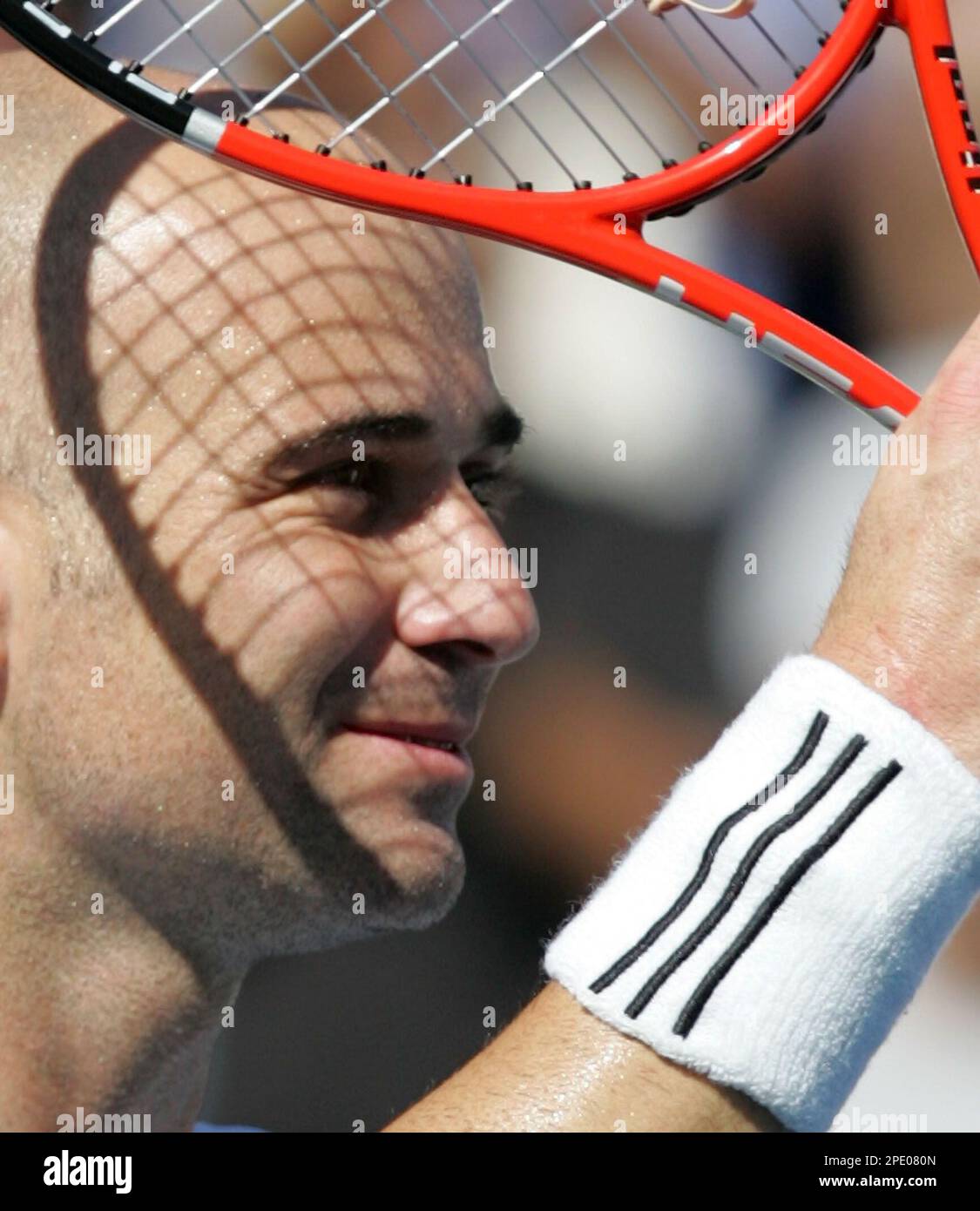 ** CORRECTS DAY AND DATE ** Andre Agassi waves to the crowd after his ...