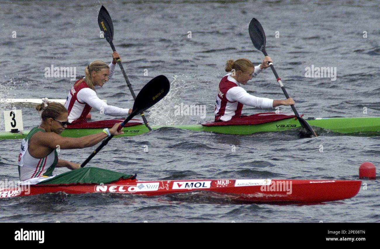 Denmark's pair, green boat at background paddle to second place with ...