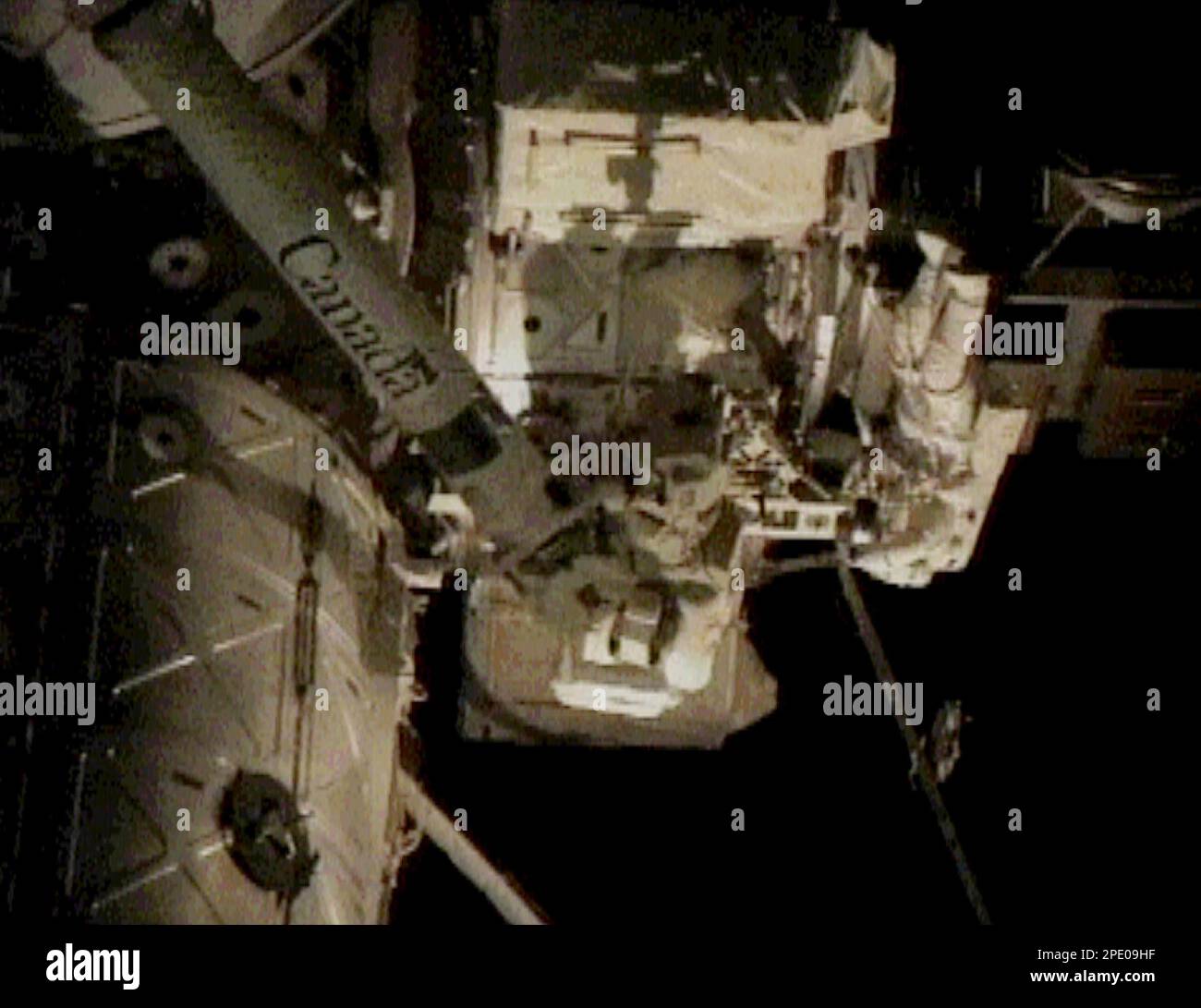 In this image from NASA TV space shuttle Discovery Mission Specialist ...