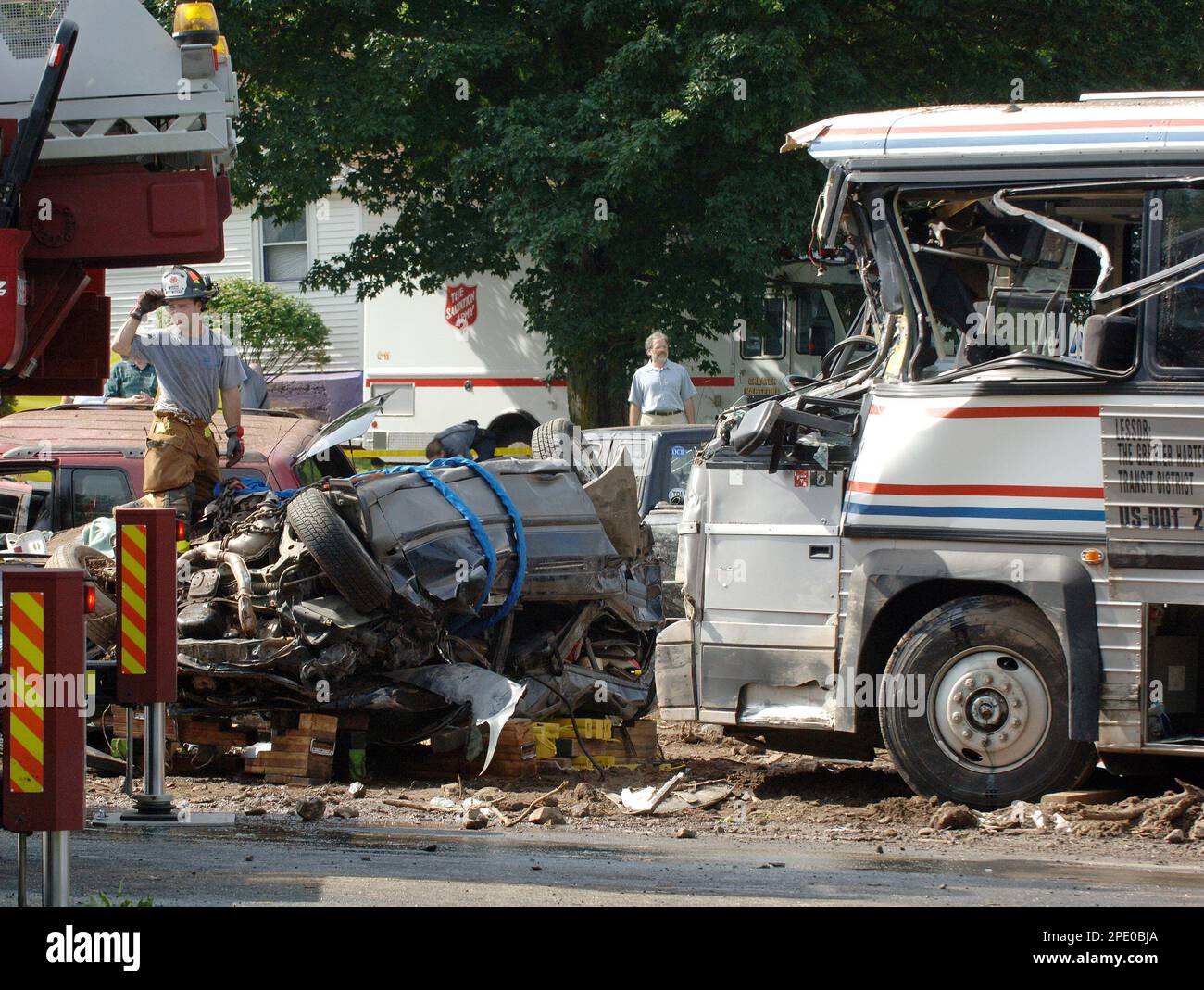 An Avon fire department captain, left, stands near the remains of a ...