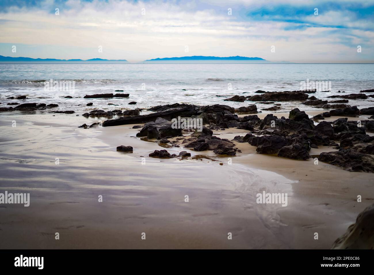 A landscape of a rocky shore of the sea on a gloomy rainy day Stock ...