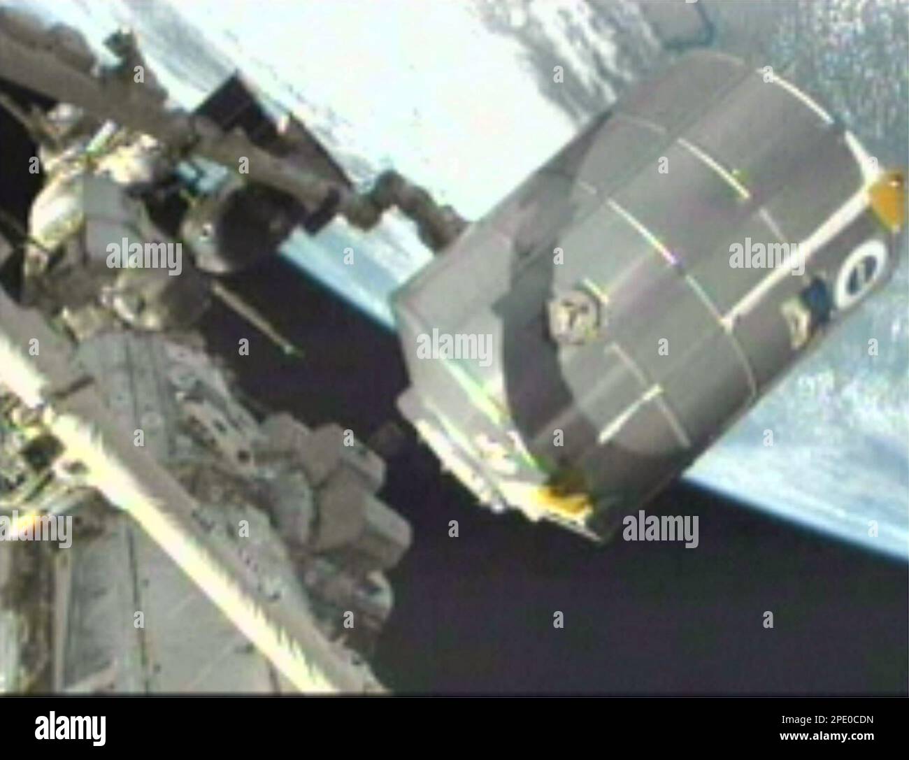 Discovery's robot arm raises the Raffaello Multi-Purpose Logistics ...