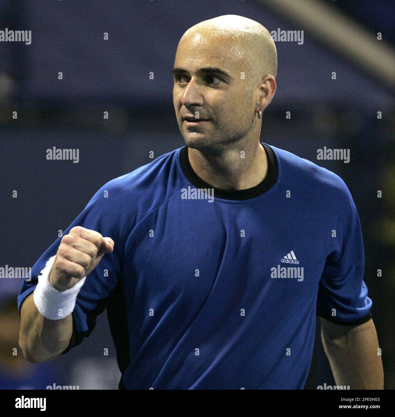 Andre Agassi pumps his fist after his win over Jean-Rene Lisnard of ...