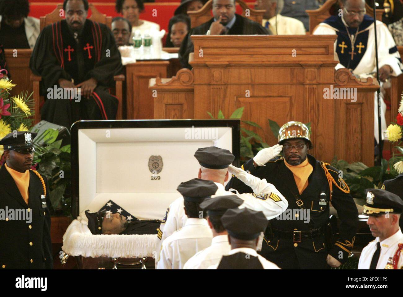 Newark police officers salute the casket of Newark Special Police ...