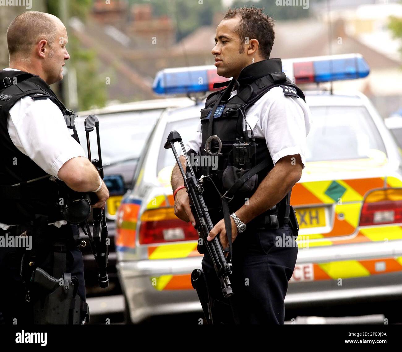 Two armed British police officers on duty in Finchley, London, Tuesday ...