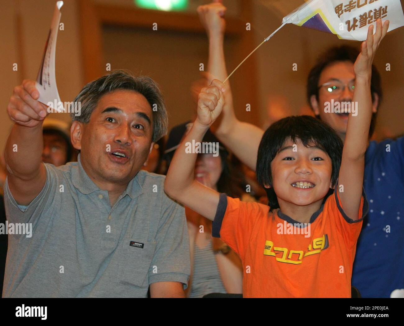 Kazuo Hashimoto, left, a citizen, and his 10-year-old son Kengo ...