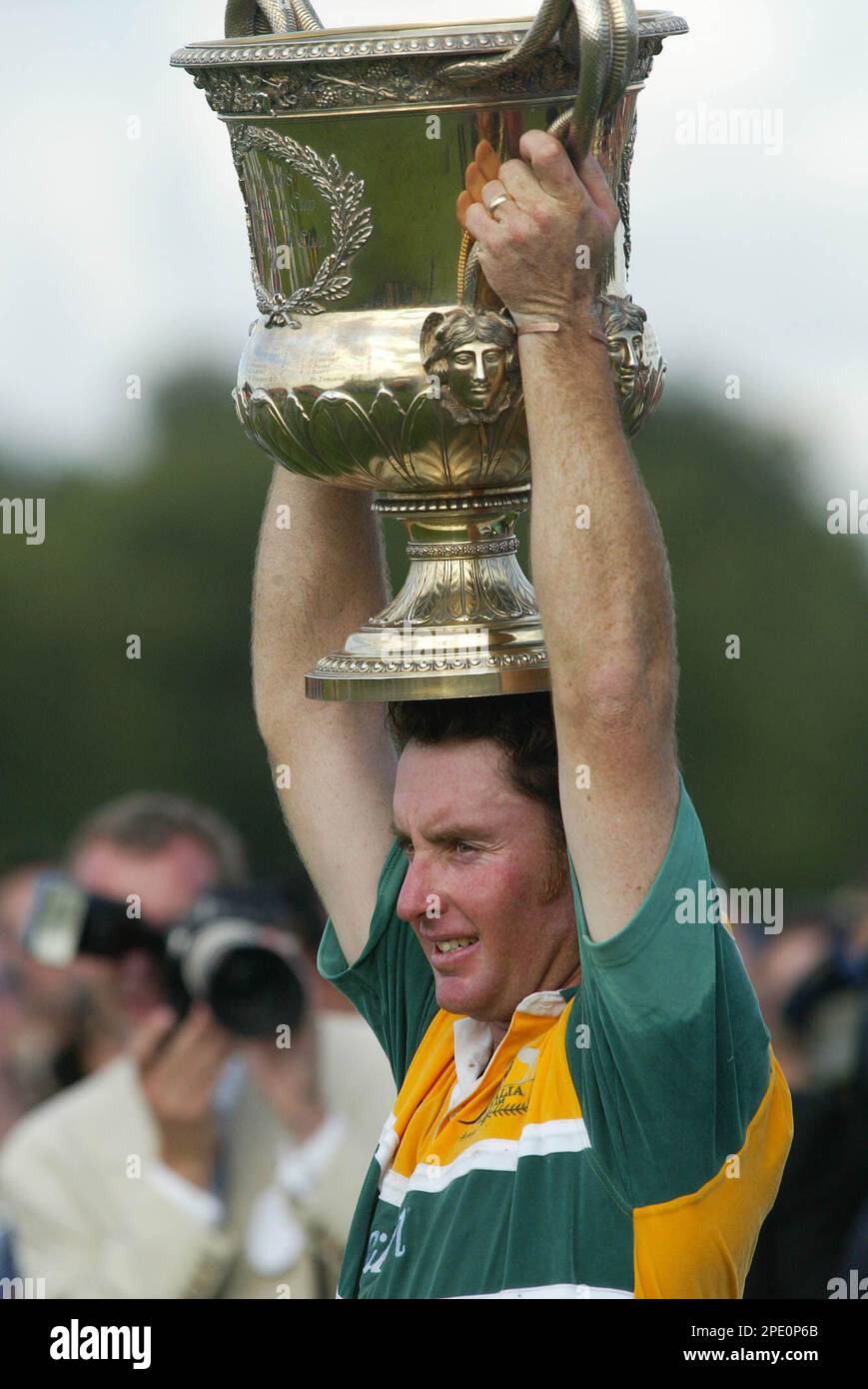 Australia's Polo Team capitain, Glen Gilmore hold up the Cartier Trophy ...
