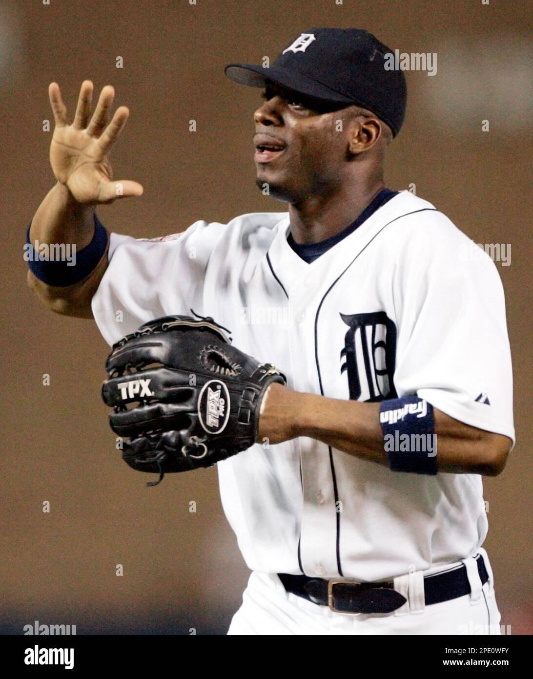 Detroit Tigers' Craig Monroe celebrates going 5-for-5 and driving in ...