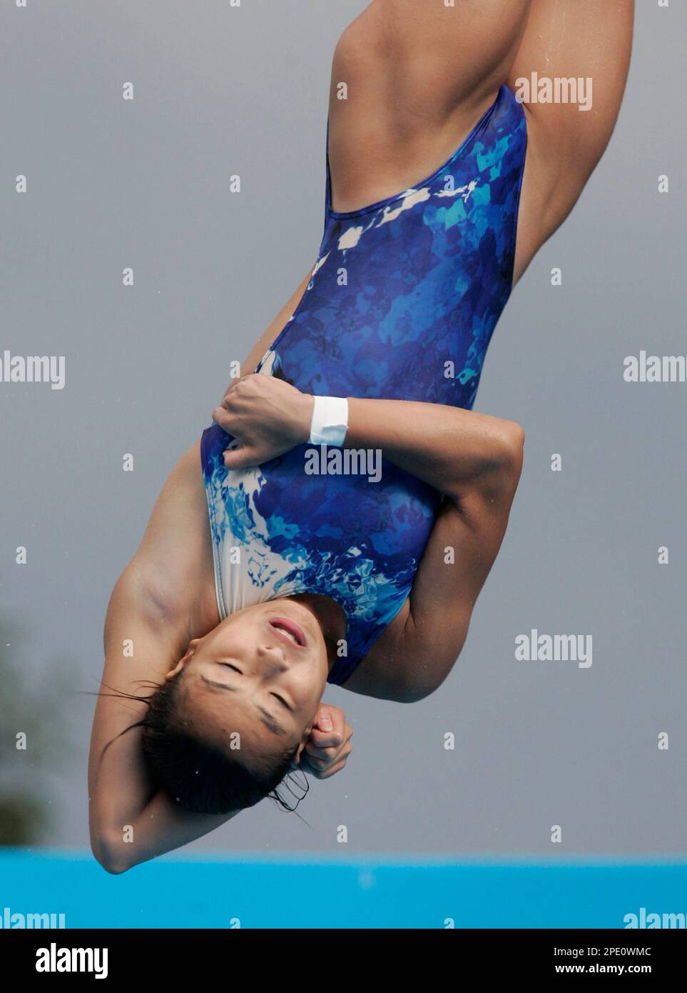 China's Min Xia Wu performs a dive on her way to winning the silver ...