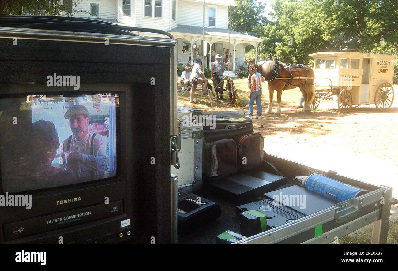 Robert Kisler, left in monitor, portraying an early 20th century ...