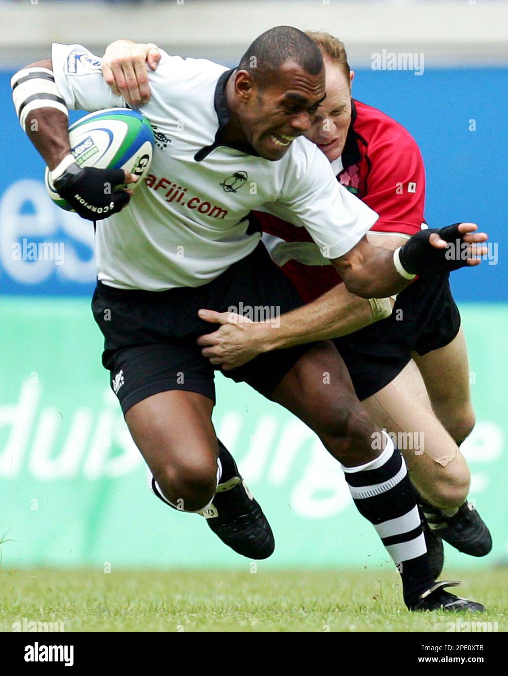 Jone Daunivucu of Fiji Islands, left, fights for the ball against ...
