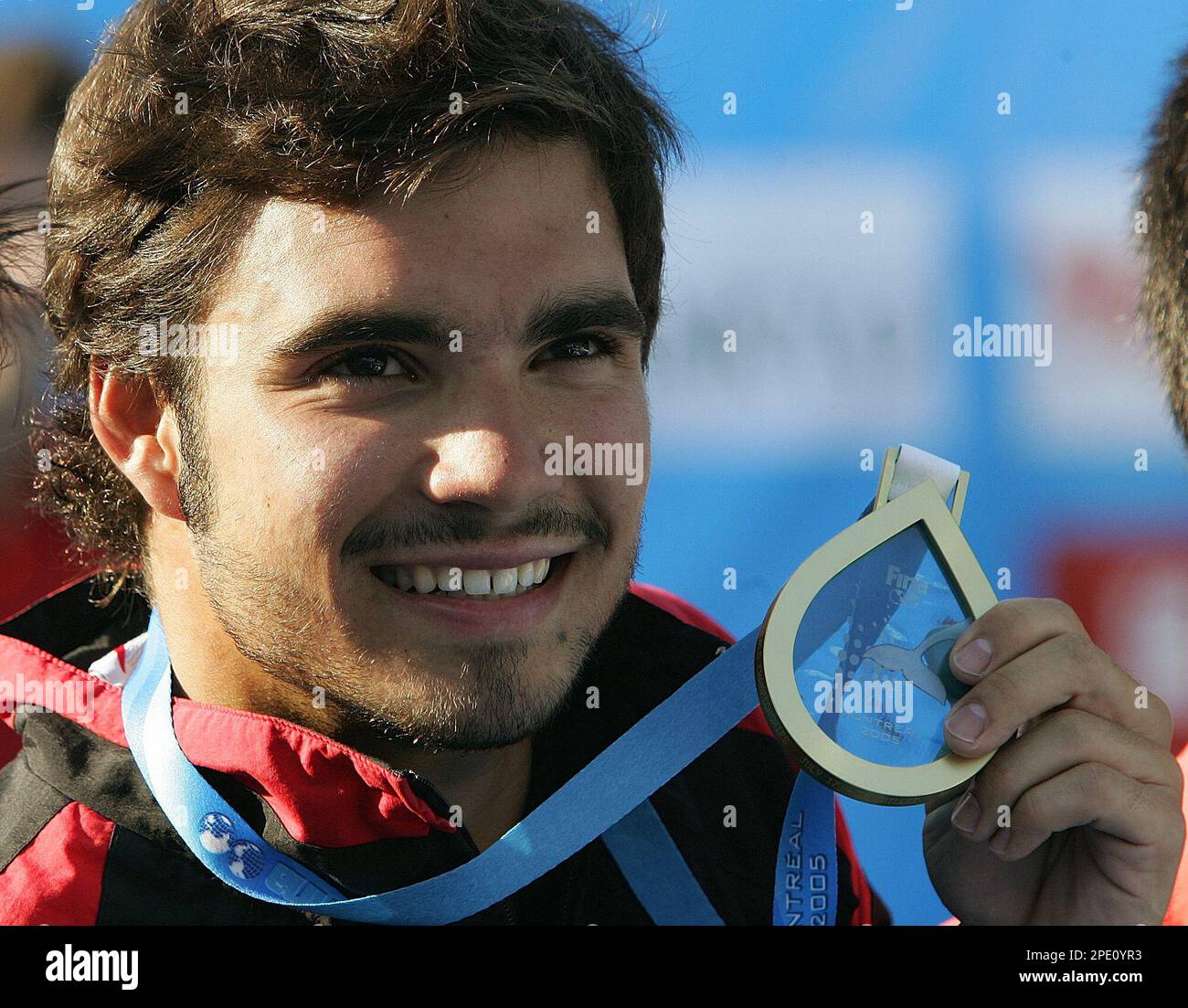 Canada's Alexandre Despatie shows off his gold medal Thursday, July 21 ...