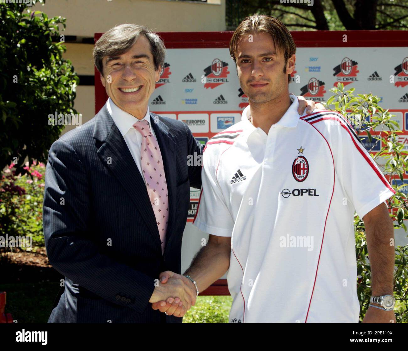 AC Milan newly signed forward Alberto Gilardino, right, shakes hands ...