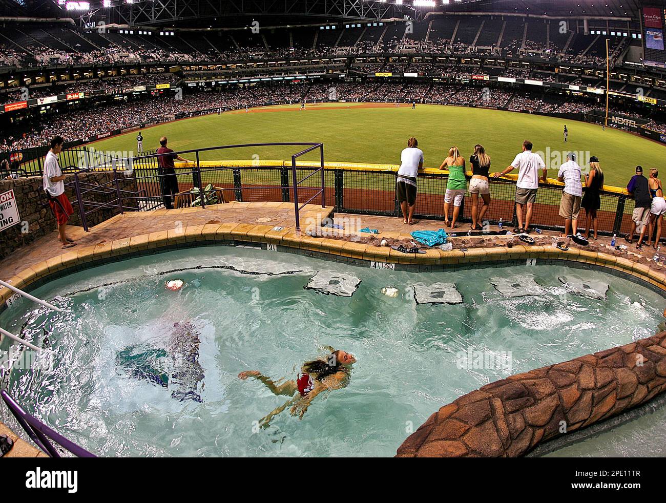 Baseball fans enjoy the right field pool at Bank One Ballpark Wednesday ...