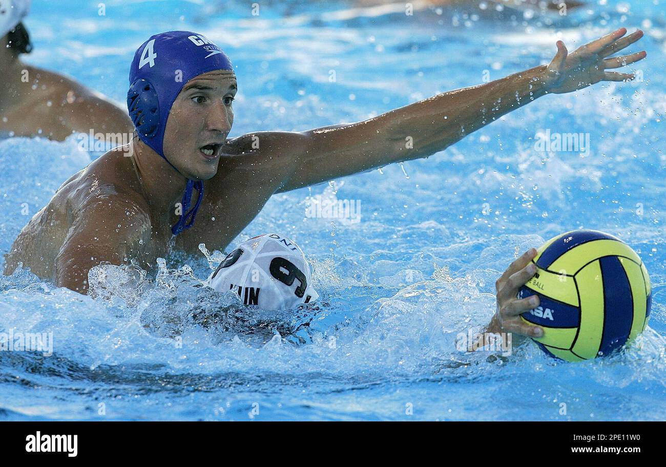 Canada's Kevin Michell (4), left, tries to block a pass from Hungary's ...