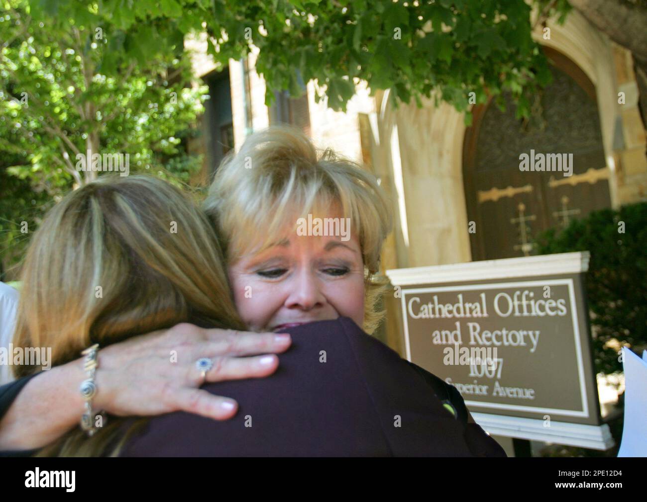 Colleen Hager, of Charlotte, N.C., facing camera, hugs Barbara Blaine ...