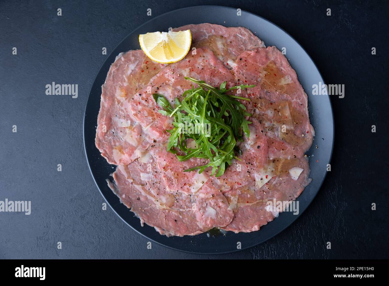 Marbled beef carpaccio with arugula, parmesan cheese, olive oil and ...