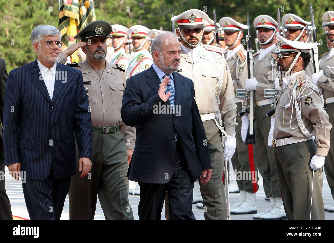 Iraqi Prime Minister, Ibrahim al-Jaafari, center, waves as he and ...