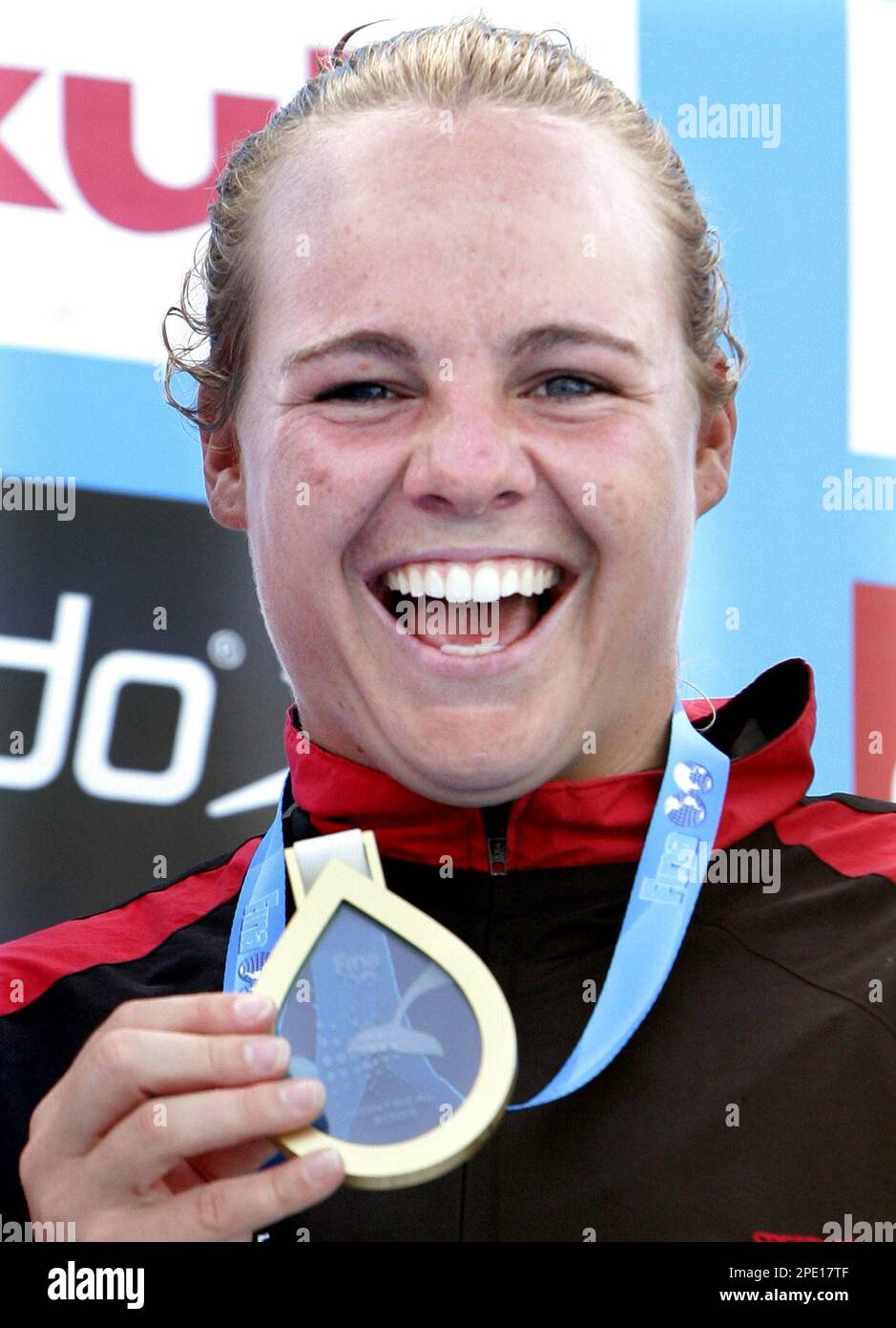 Canada's Blythe Hartle smiles as she shows off her gold medal after ...