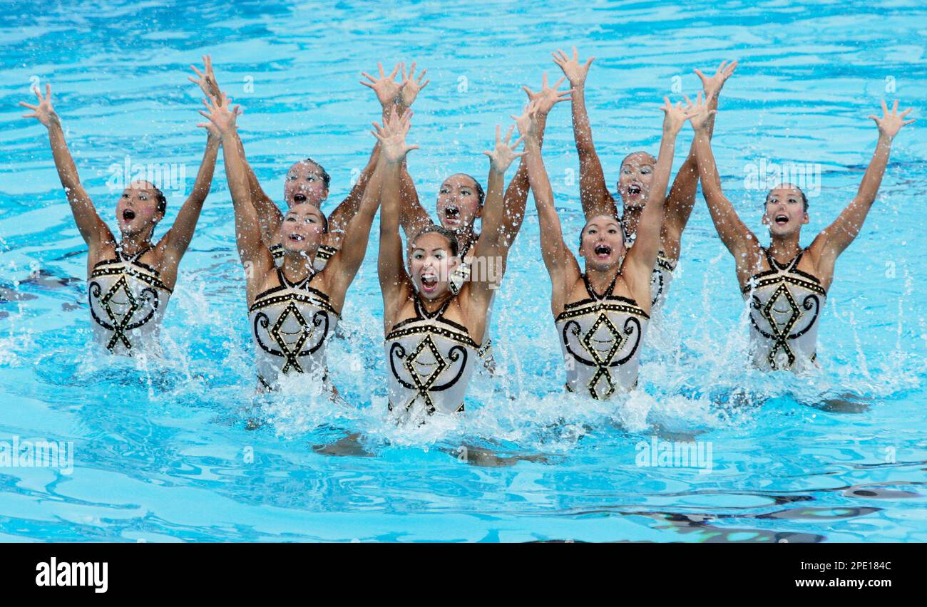 Members of the Japanese team perform their routine to place second in ...