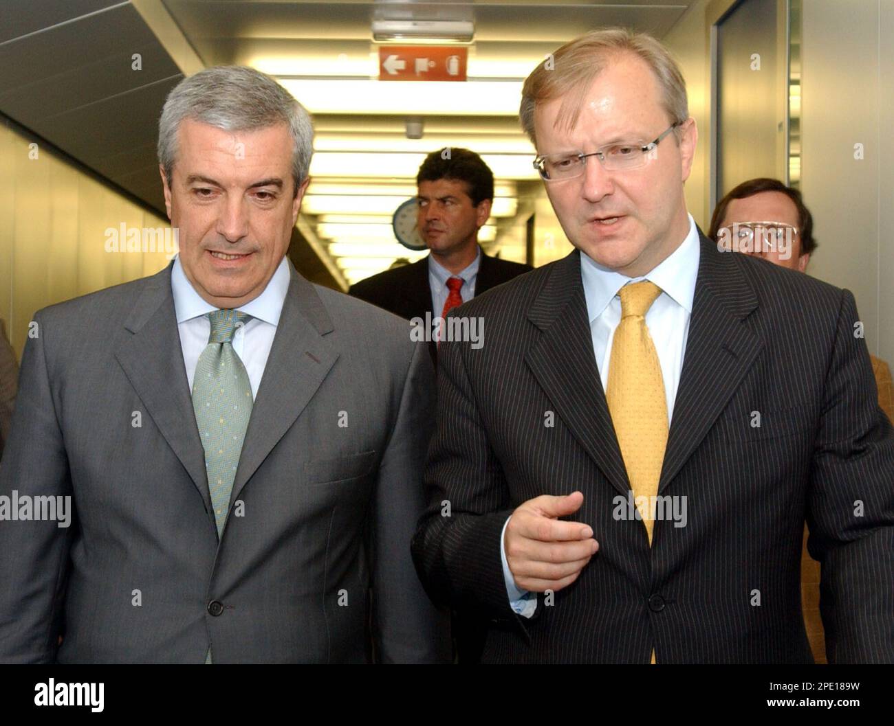 European Union Commissioner for Enlargement Olli Rehn, right, talks to ...