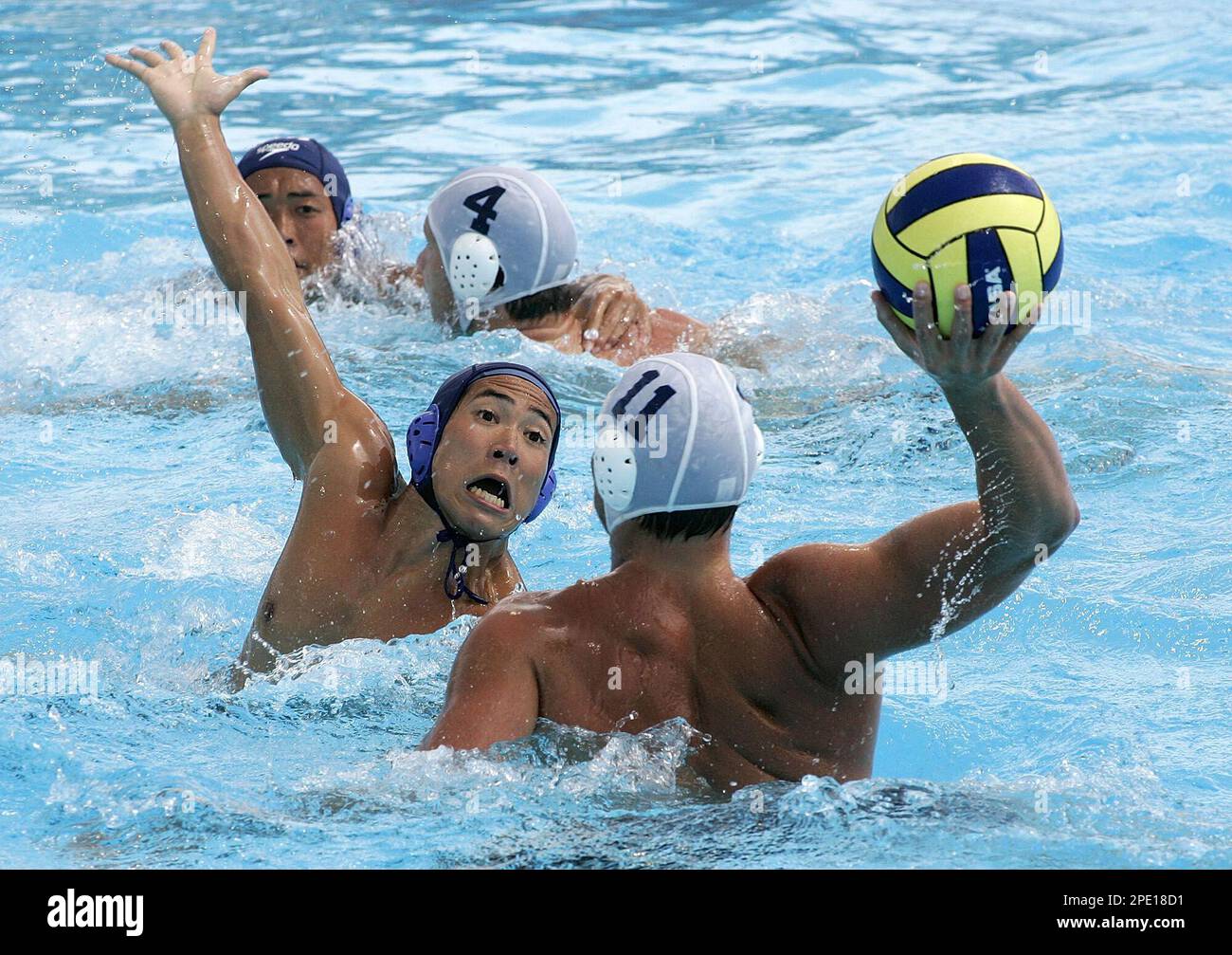 Japan's Taichi Sato tries to block a shot from USA's Jesse Smith (11 ...