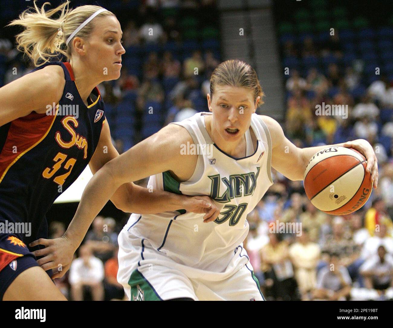 Minnesota Lynx guard Katie Smith (30) drives against Connecticut Sun ...