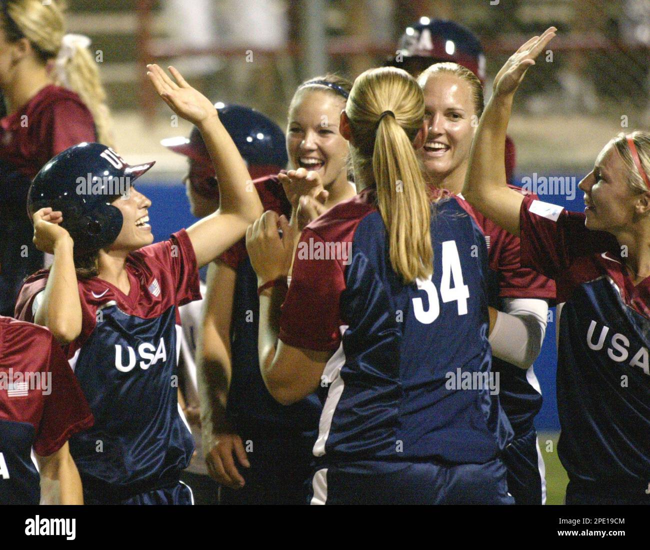 Vicky Galindo, left, of the U.S. team gets high-fives from her ...