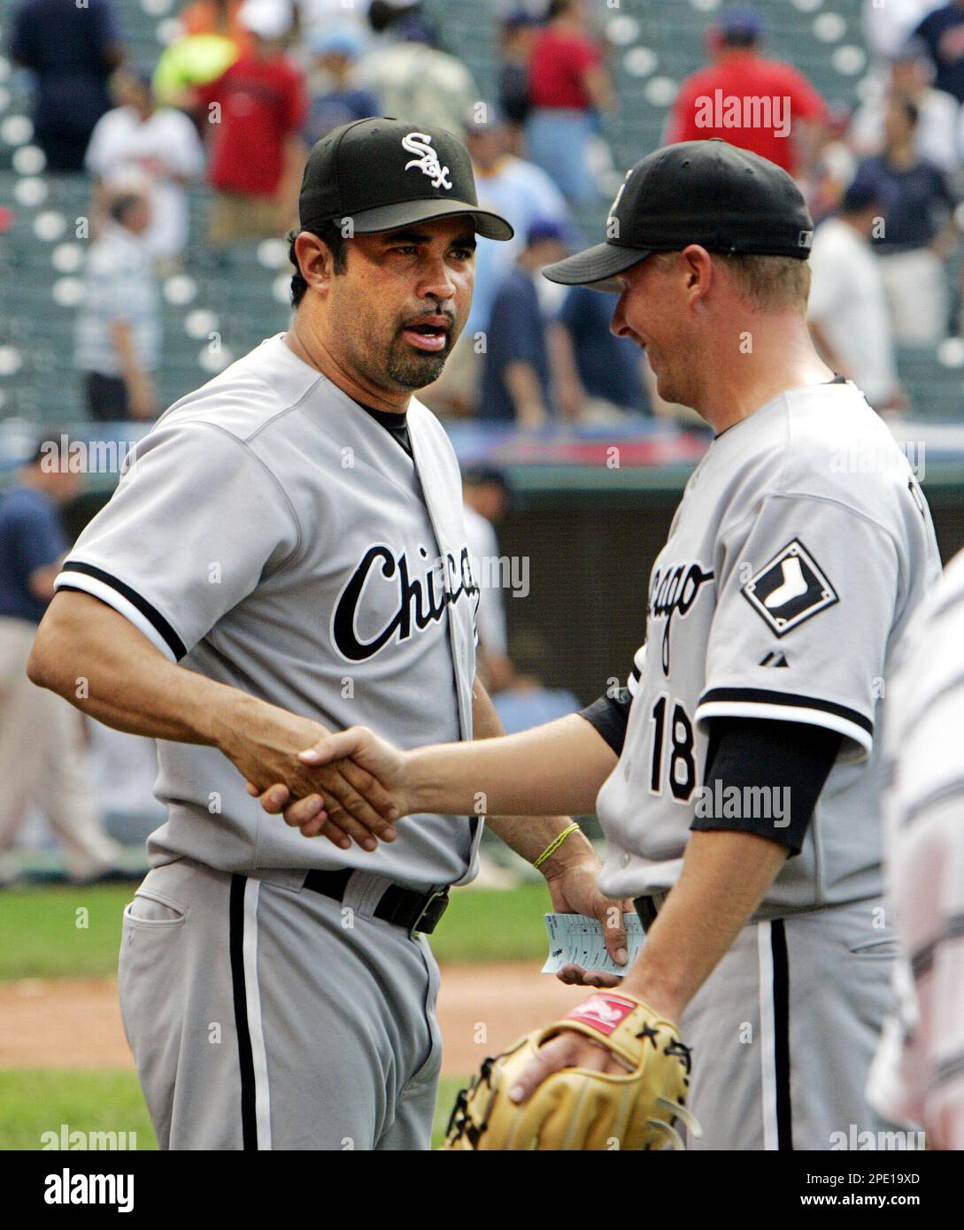 Chicago White Sox manager Ozzie Guillen, left, congratulates relief ...