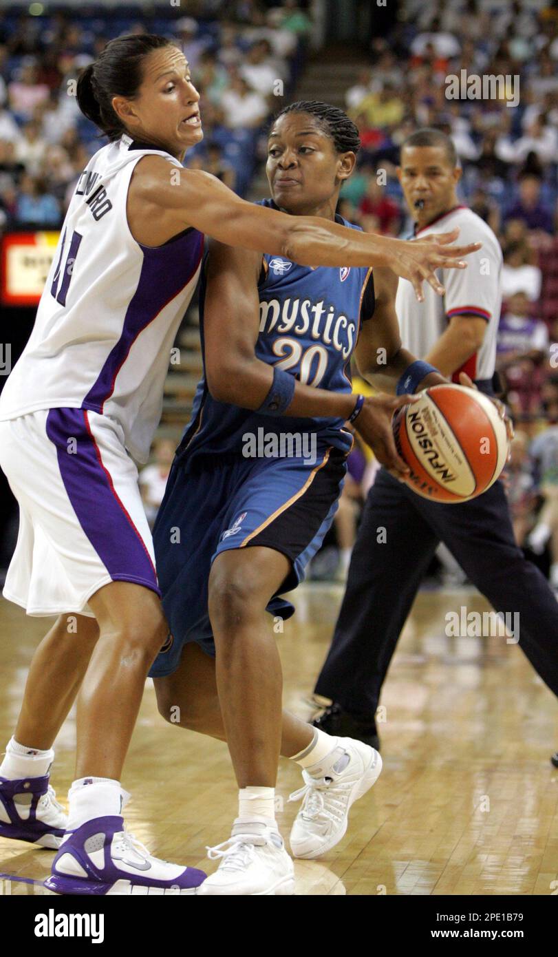 Washington Mystics guard Alana Beard, right, looks to pass off over the ...