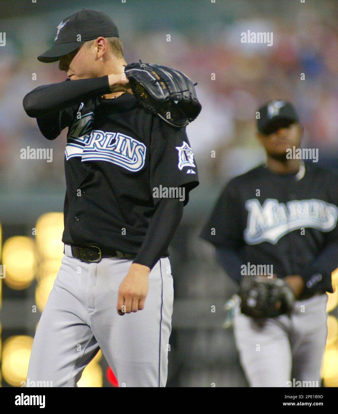 Florida Marlins pitcher Scott Olsen heads for the dugout after being ...