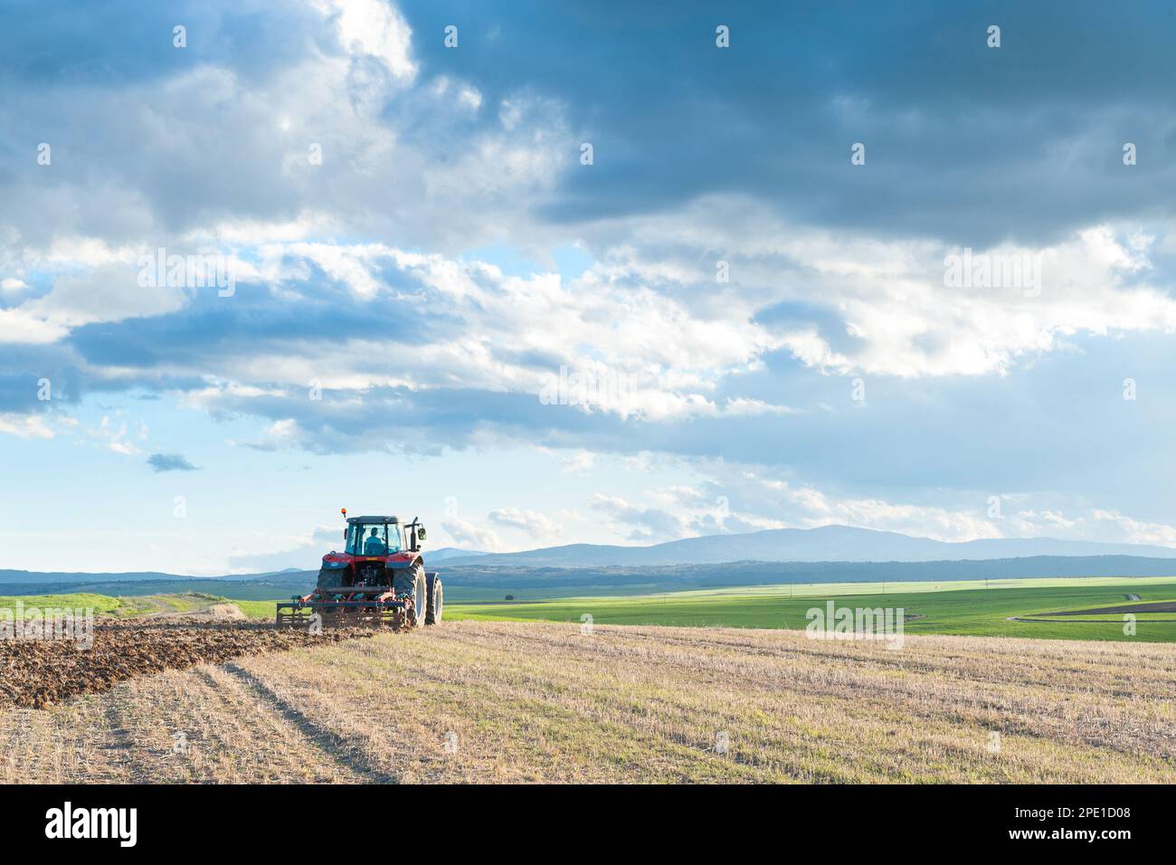 agricultural machinery working the land in the field Stock Photo - Alamy