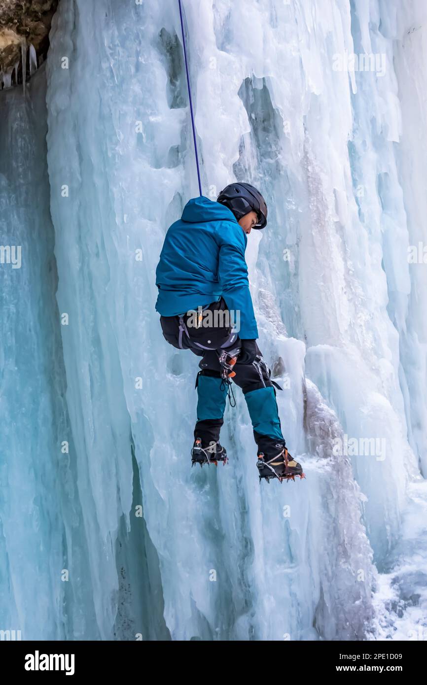 Ice climber lowering after climbing Curtains, a frozen seep formation ...