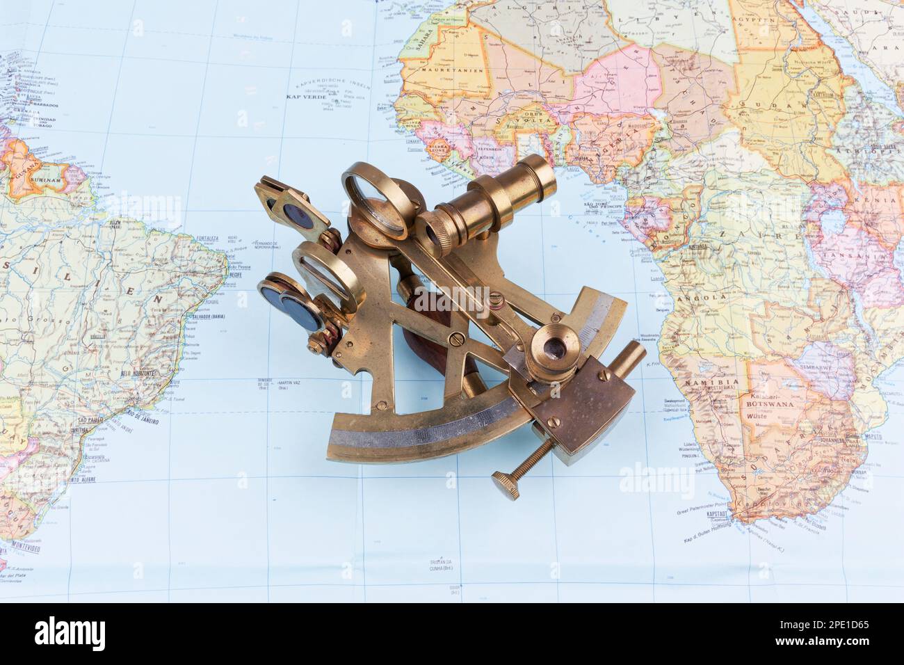 nautical sextant with optics lying on paper world map Stock Photo - Alamy