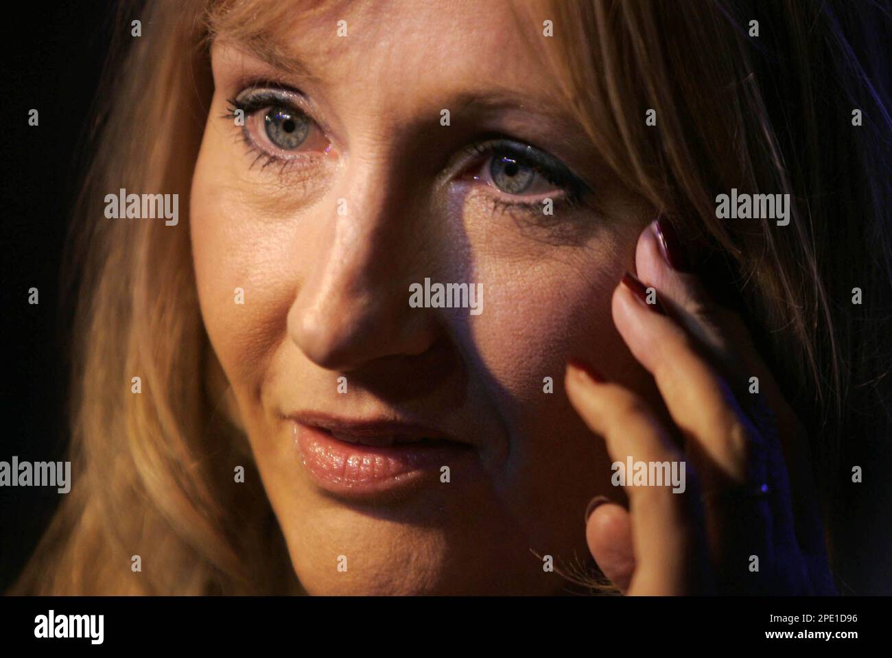 British author J.K. Rowling gives a television interview as she arrives ...