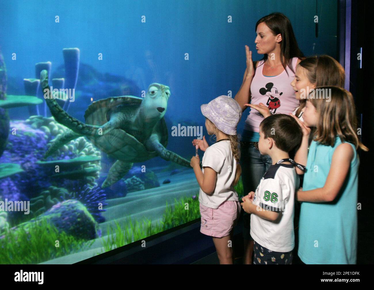 Amanda Beard, Olympic gold medalist, and a group of children blow a ...