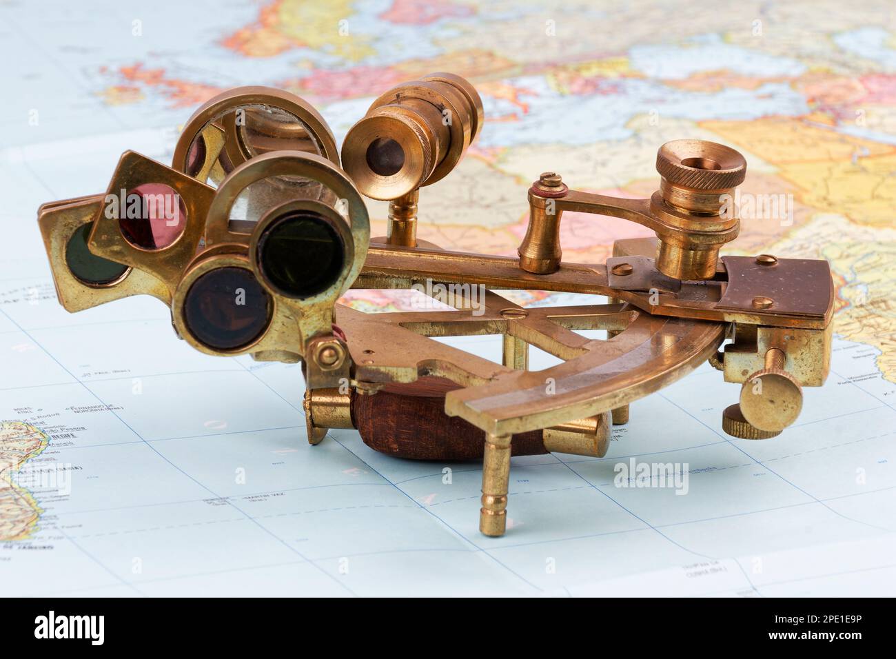 nautical sextant with optics lying on paper world map Stock Photo - Alamy