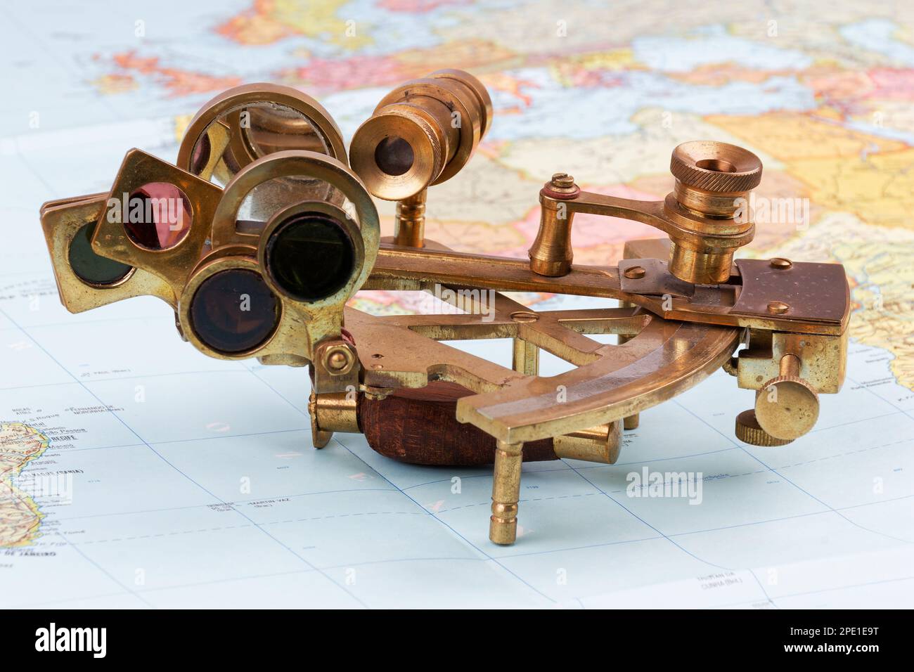nautical sextant with optics lying on paper world map Stock Photo - Alamy