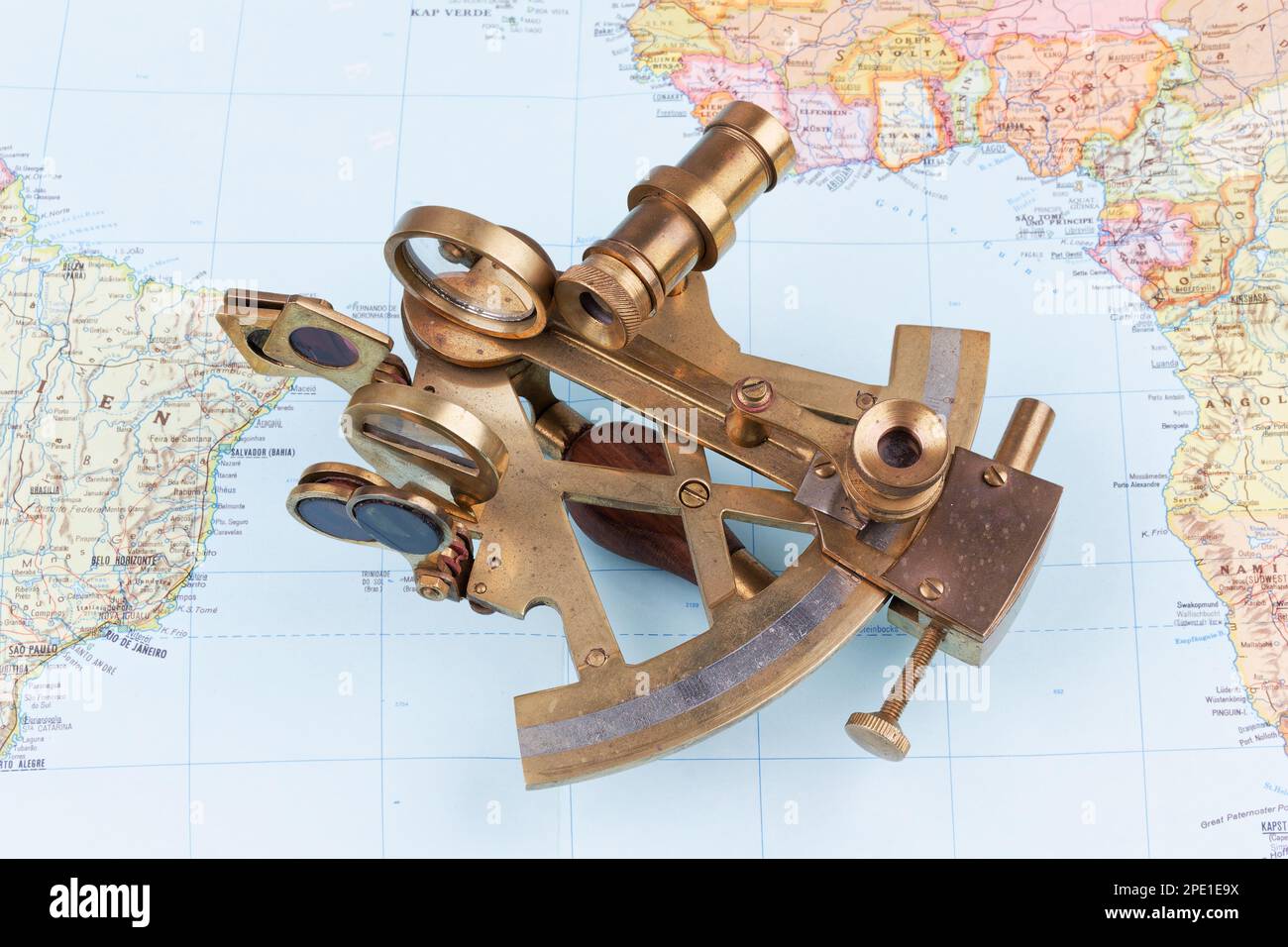 nautical sextant with optics lying on paper world map Stock Photo - Alamy