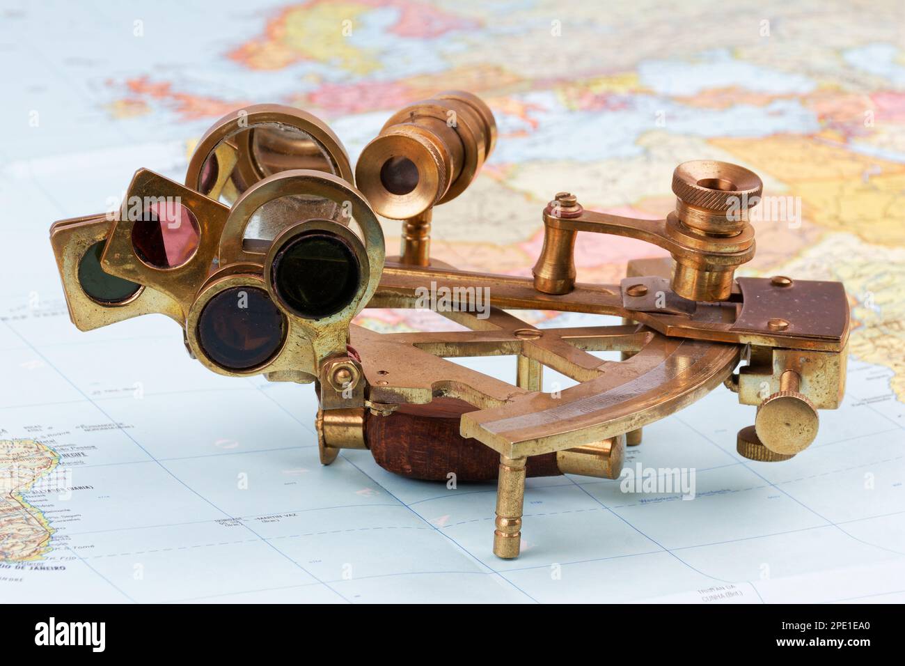 nautical sextant with optics lying on paper world map Stock Photo - Alamy